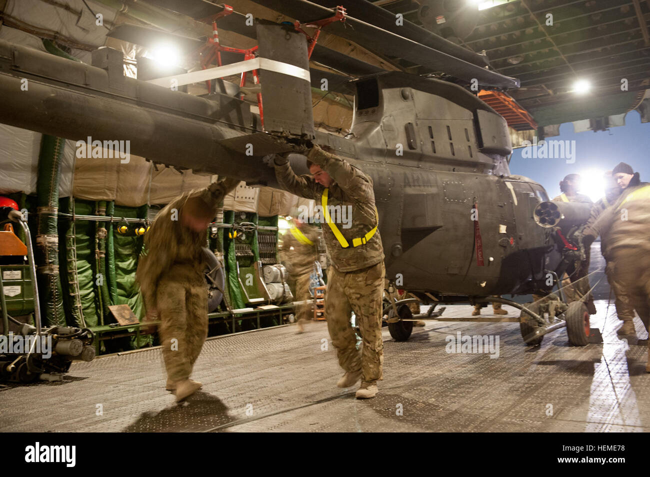 Soldiers from 2nd Squadron, 17th Cavalry Regiment load an OH-58D Kiowa ...