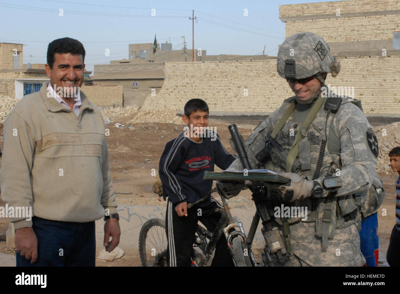 Lt. Col. Mike Lawrence, right, commander, 2nd Battalion, 23rd Infantry ...