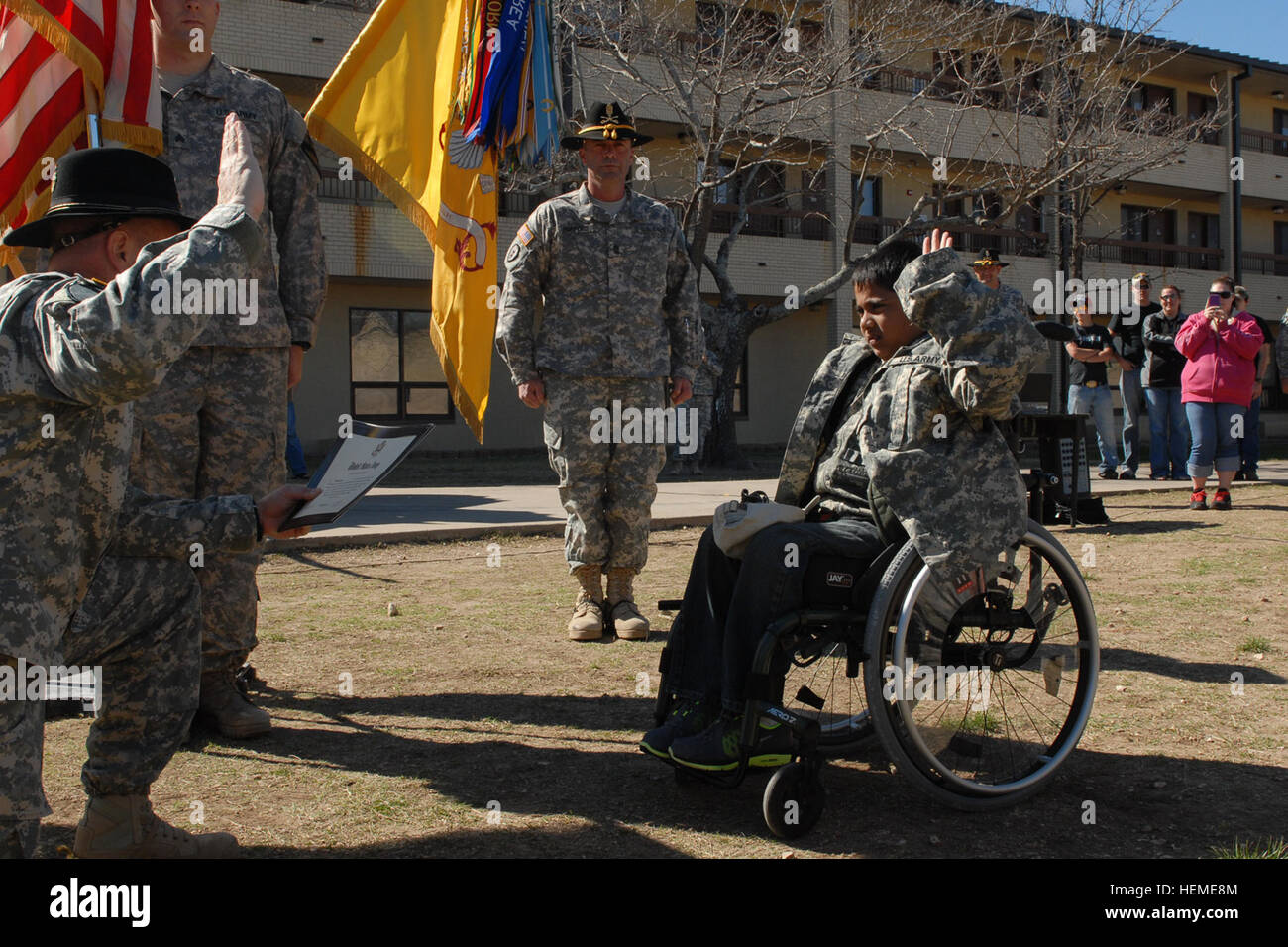 Nine-year-old Houston native Neil Sawh (right) takes the oath of ...