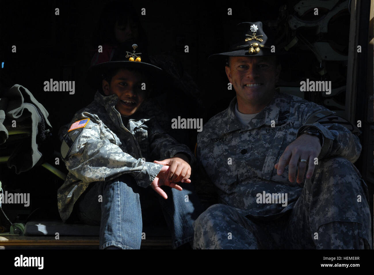 Nine-year-old Houston native Neil Sawh sits with San Francisco native ...