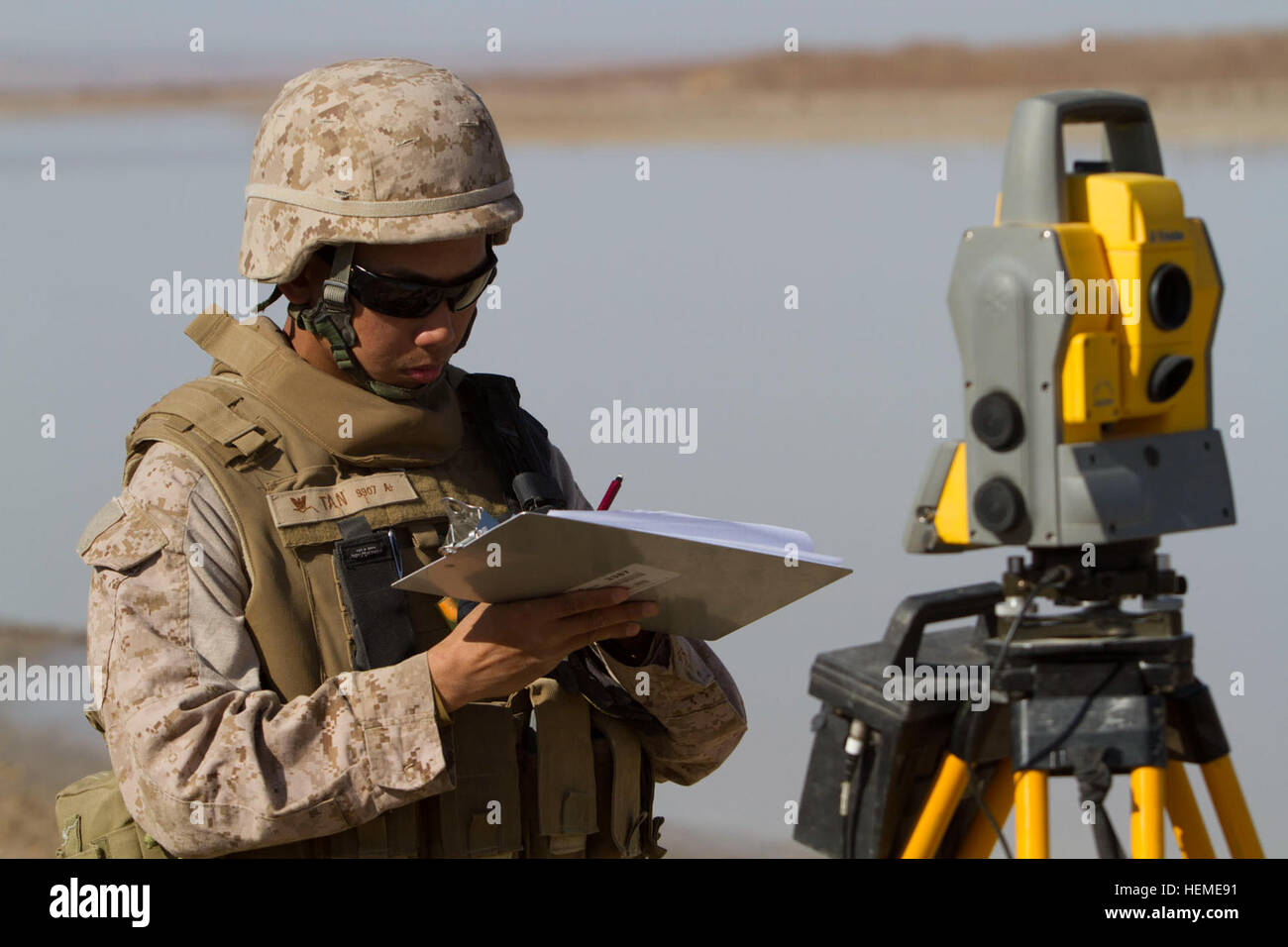 U.S. Navy Engineer's Aide 3rd Class Irwin Tan, a surveyor with Naval ...
