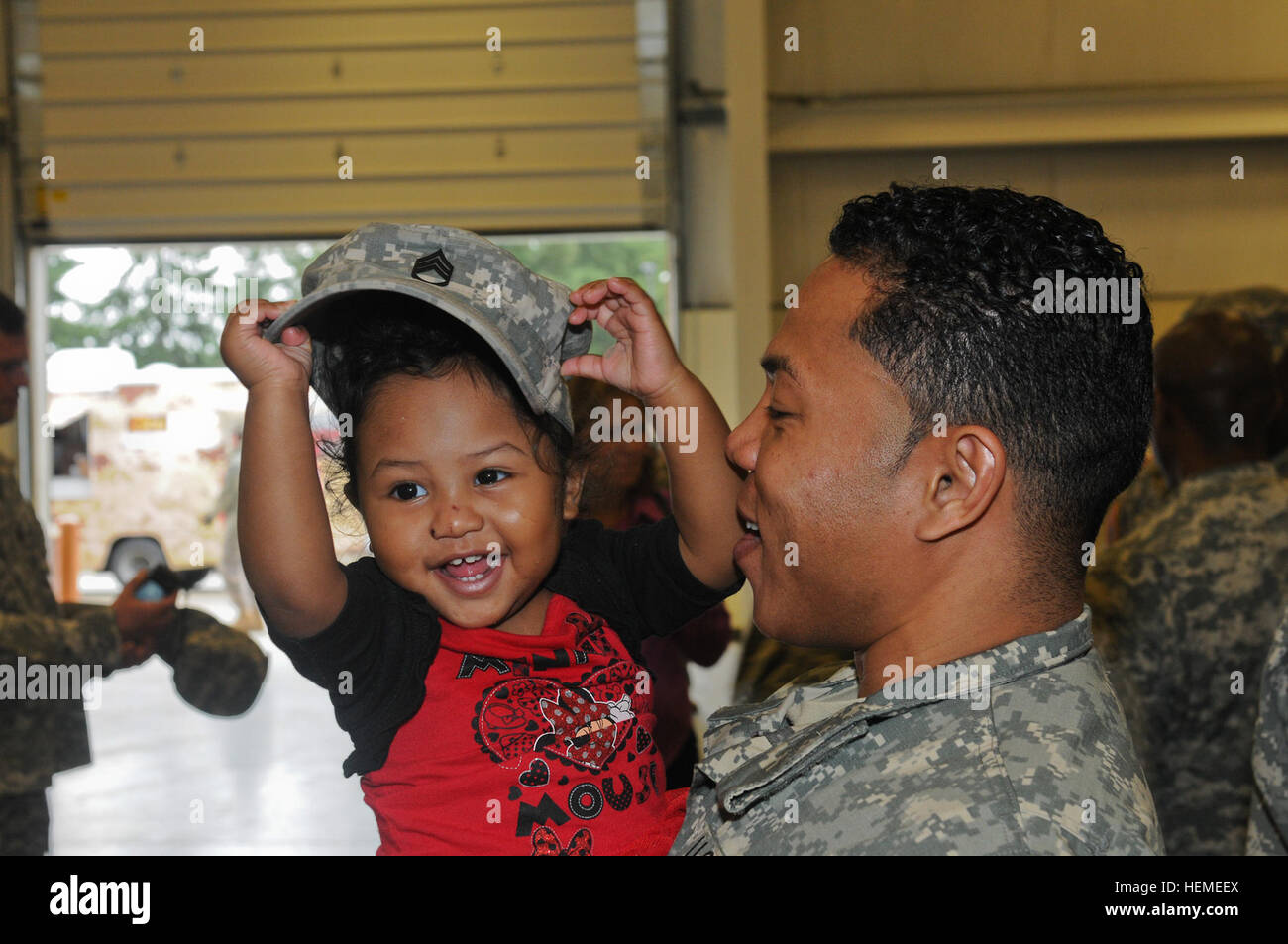 JOINT BASE LEWIS-McCHORD, Wash. - Emma Sharee Calica greets her father ...