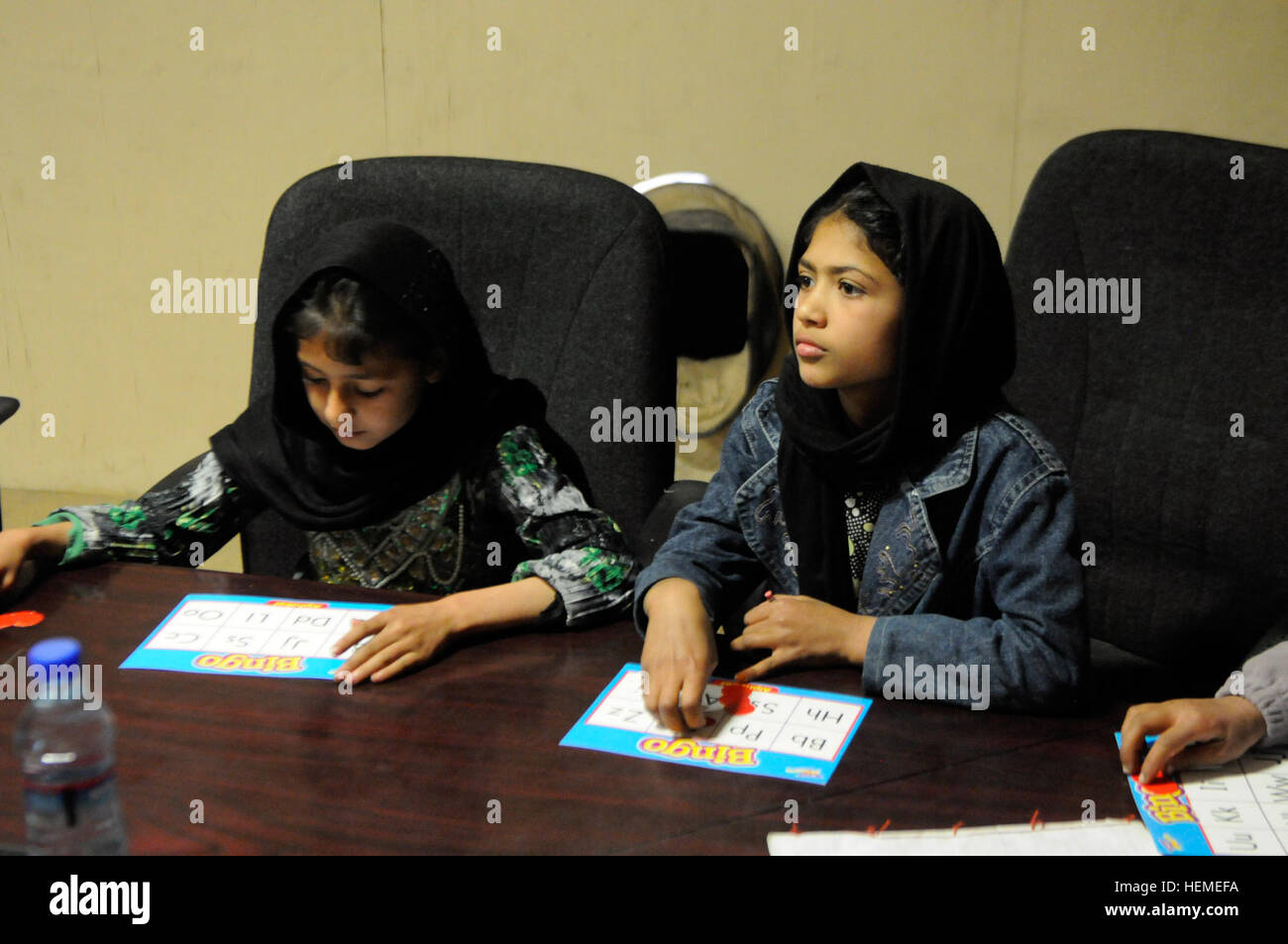 Local Afghan girls play a game of alphabet bingo to learn English ...