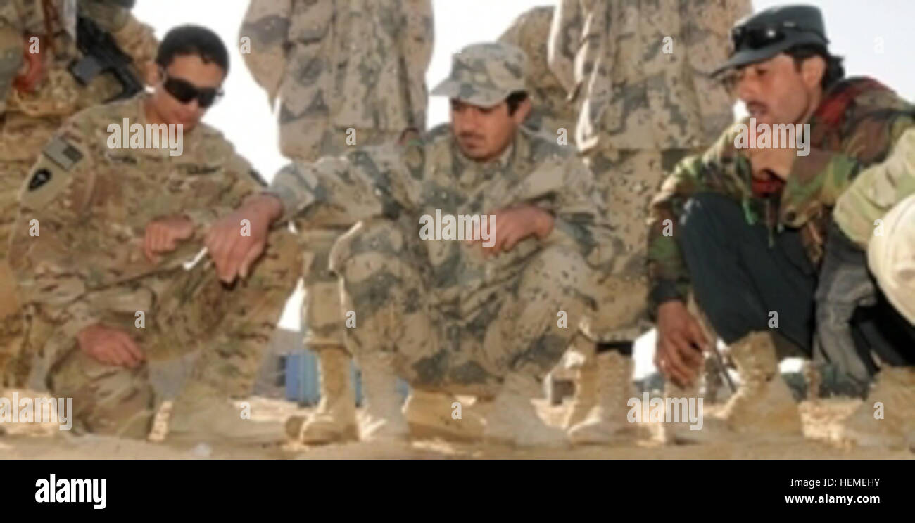 Afghan Border and Uniform Police members discuss negotiating a hazard ...