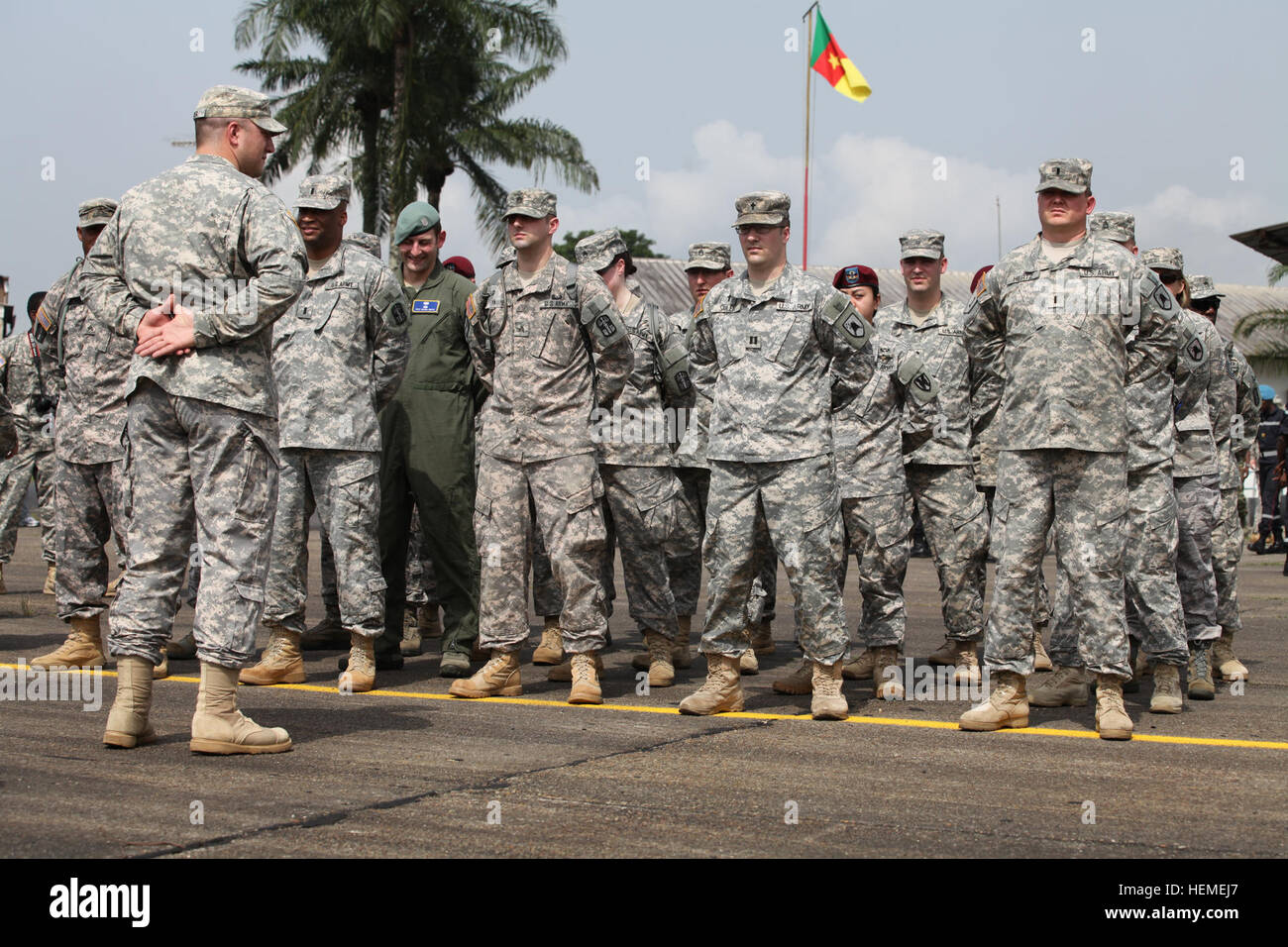 A formation of U.S. Army Soldiers and U.S. Air Force Airmen stand at ...
