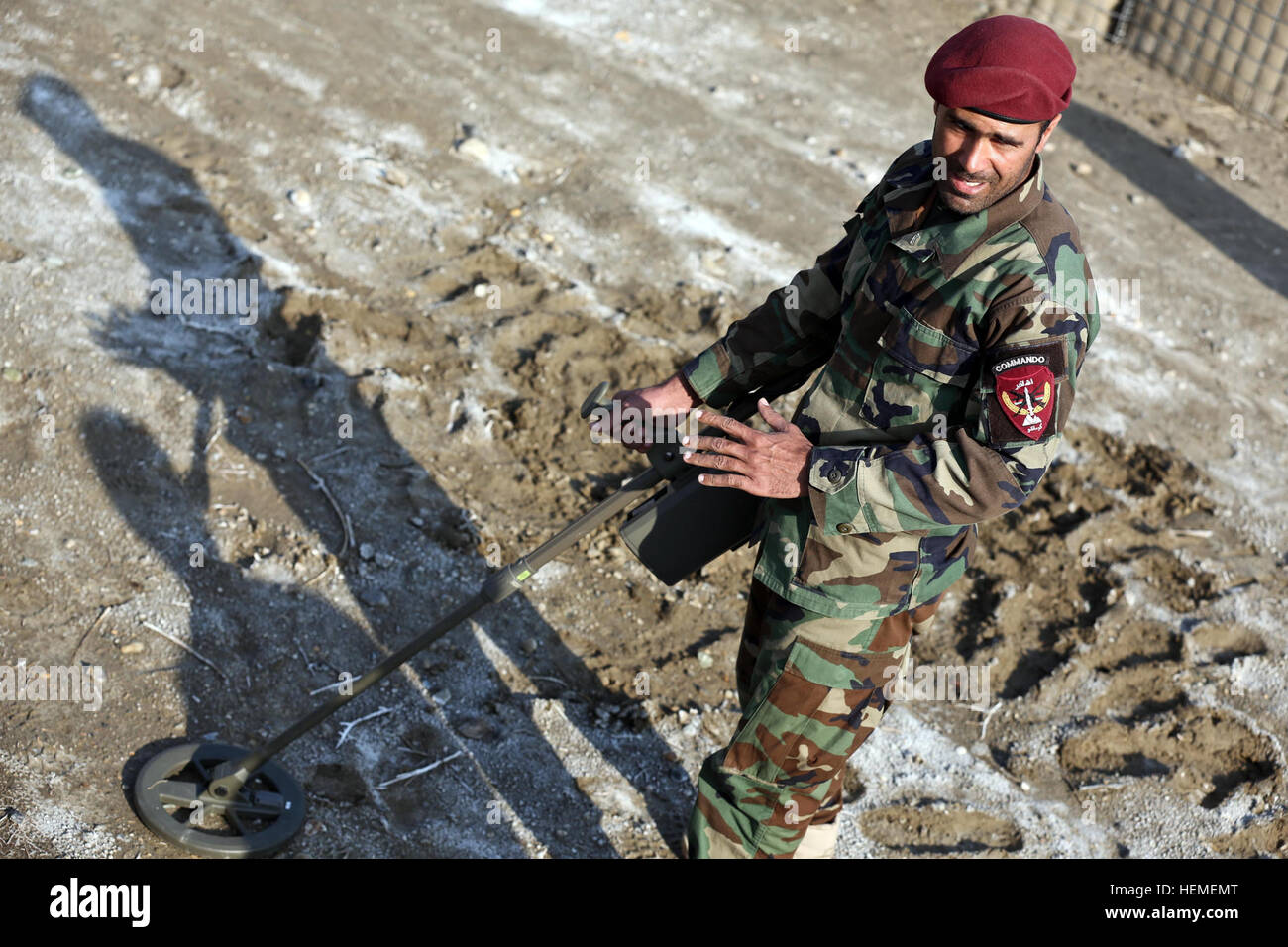 An Afghan National Army commando engineer demonstrates procedures for ...