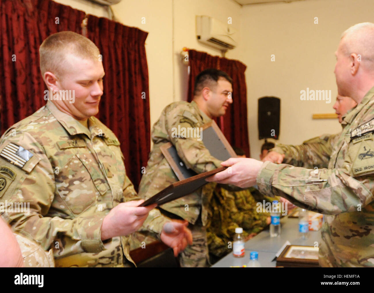 U.S. Army Col. Ken Adgie, right, the commander of the 1st Stryker ...