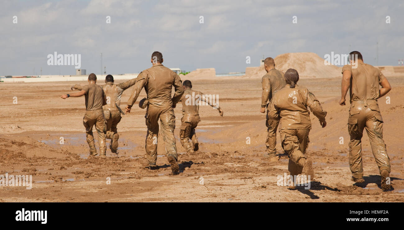 Us Army Soldiers Jump Into A Mud Puddle After Completing M1131 Stryker Infantry Carrier