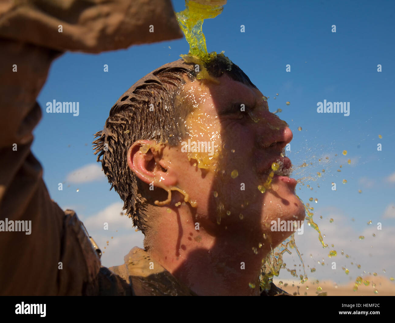 A U.S. Army soldier cleans off his face with Gatorade after M1131 ...