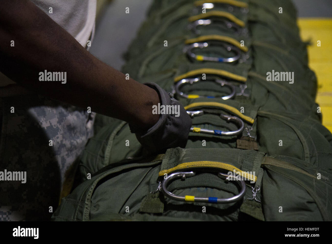 An Army Reserve parachute rigger with the 824th Quartermaster Company ...