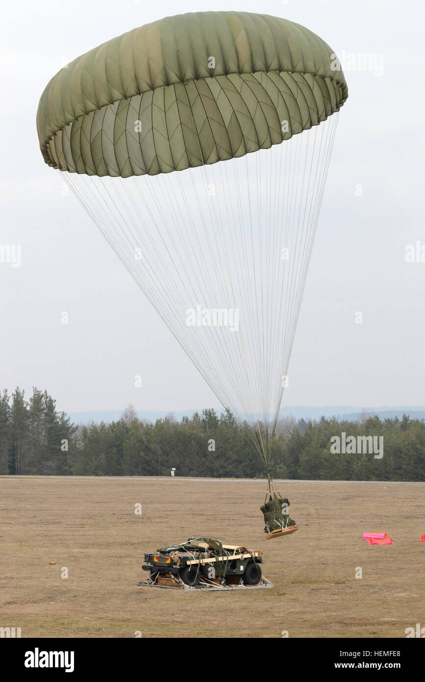 A bundle with medical equipment on a palette parachutes to the ground ...