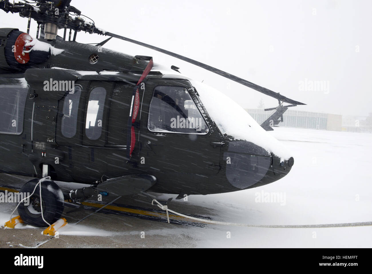 An UH-60 Black Hawk helicopter is safely secured and tied down during ...