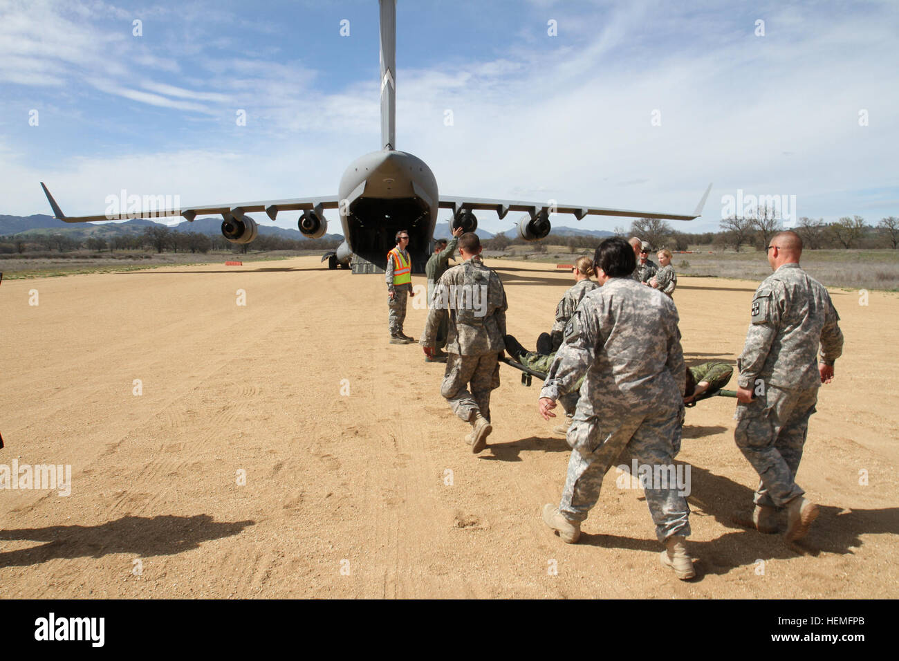 U.S. Army soldiers from the 801st Combat Support Hospital load a ...