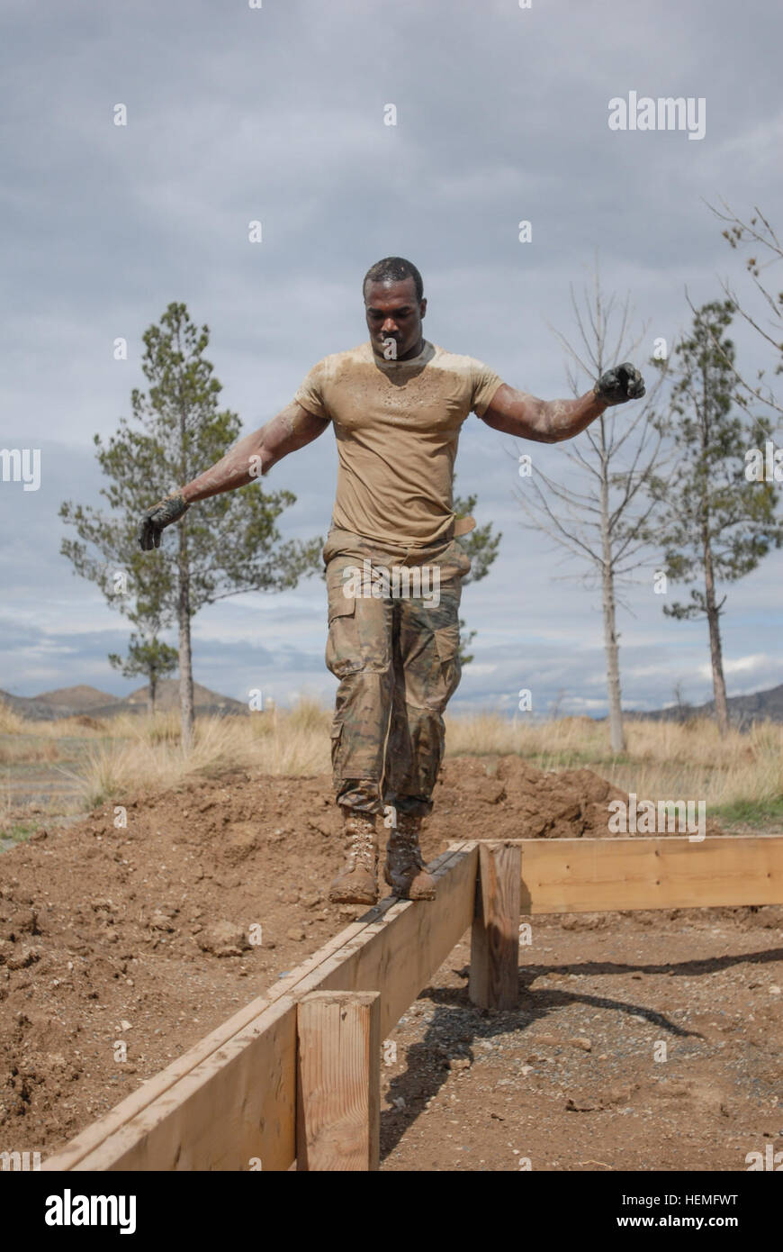 A U.S. Soldier carefully walks the balance beam while participating in ...