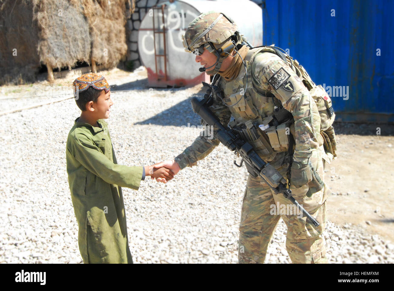 U.S. Army Cpl. Leroy Granado, right, with the 56th Infantry Brigade ...