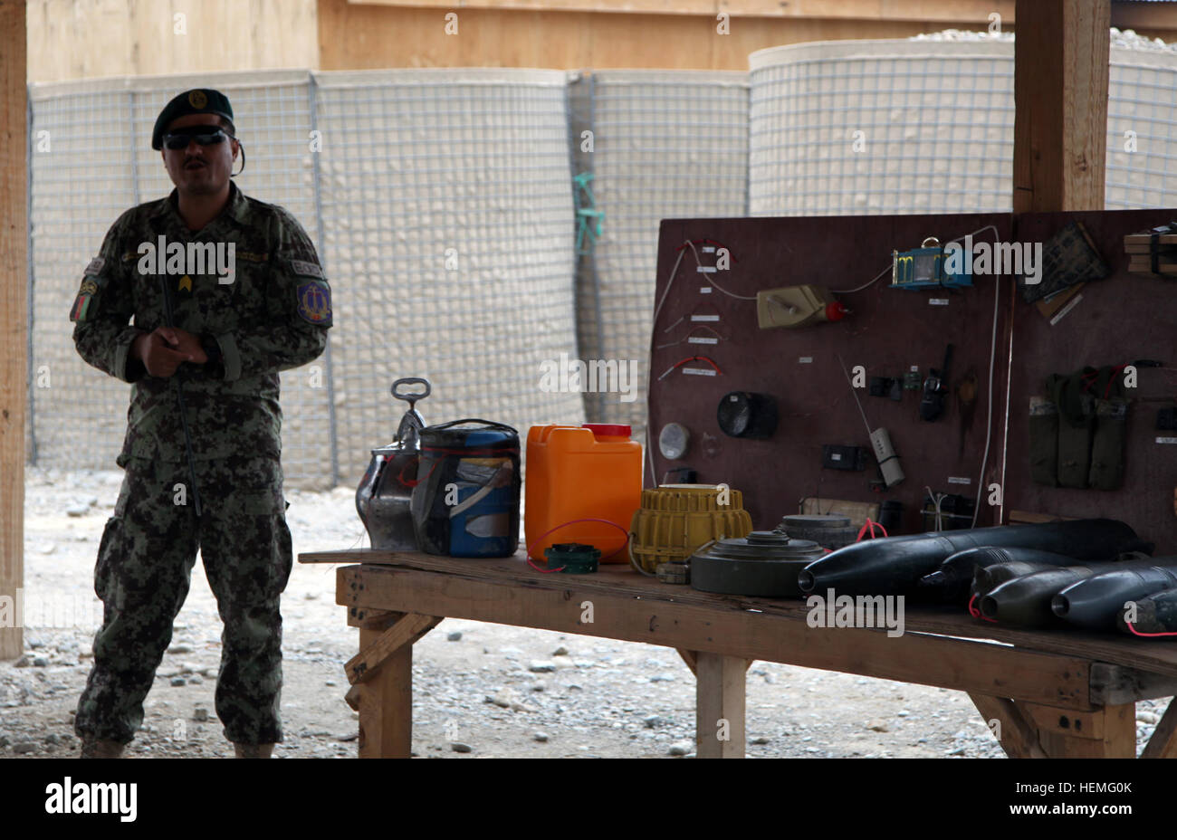 An Afghan National Army soldier explains different types of improvised ...