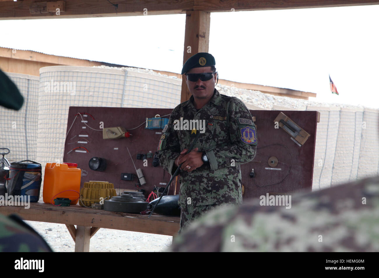 An Afghan National Army soldier explains different types of improvised ...