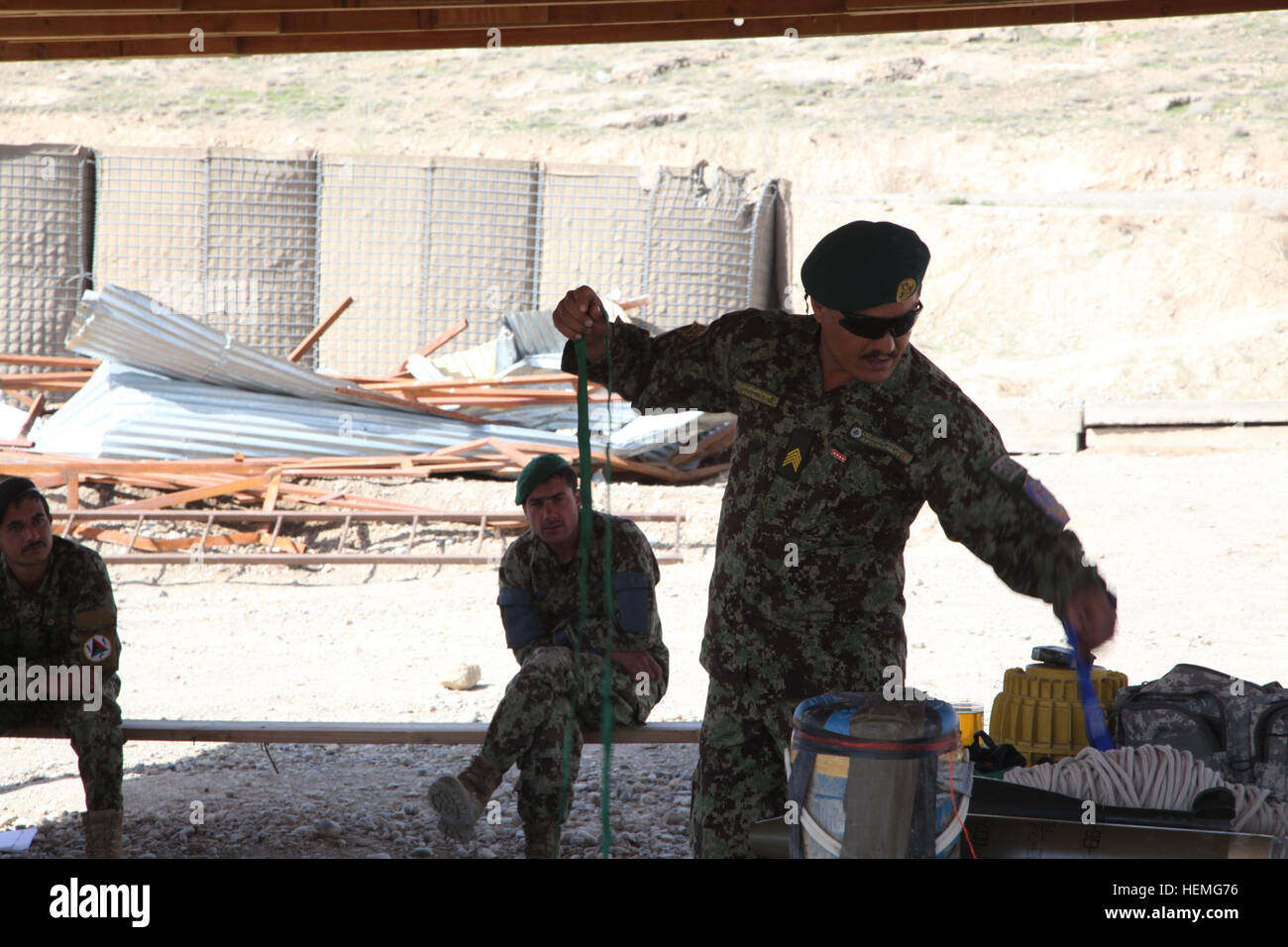 An Afghan National Army soldier demonstrates putting together a pulley ...