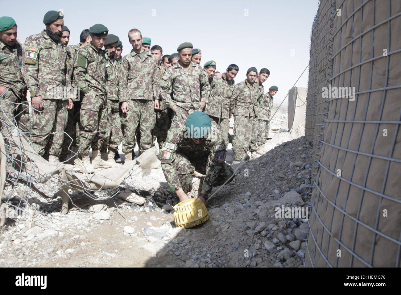 An Afghan National Army soldier demonstrates attaching a pulley system ...