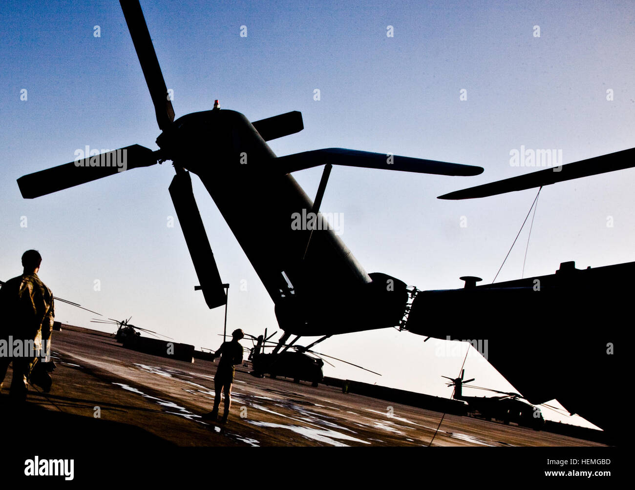 A flight line mechanic conducts maintenance on an aircraft on Forward ...