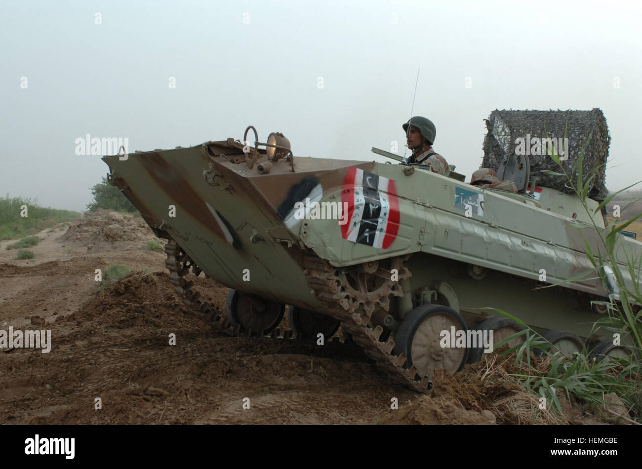 An Iraqi army drives soldier a BMP infantry fighting vehicle on a road ...