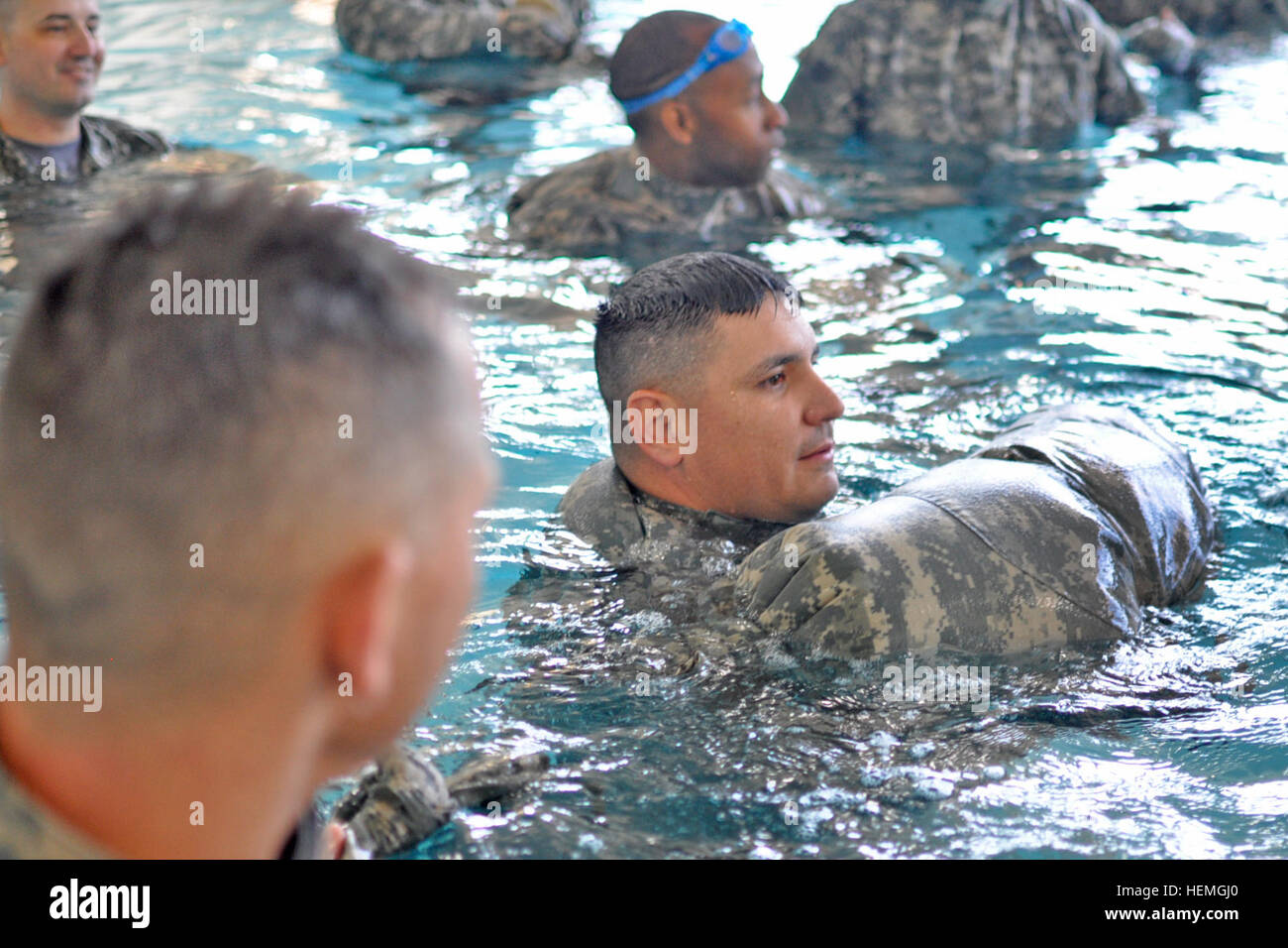 U.S. Army Sgt. 1st Class Eliodoro Molina, right, demonstrates how to ...
