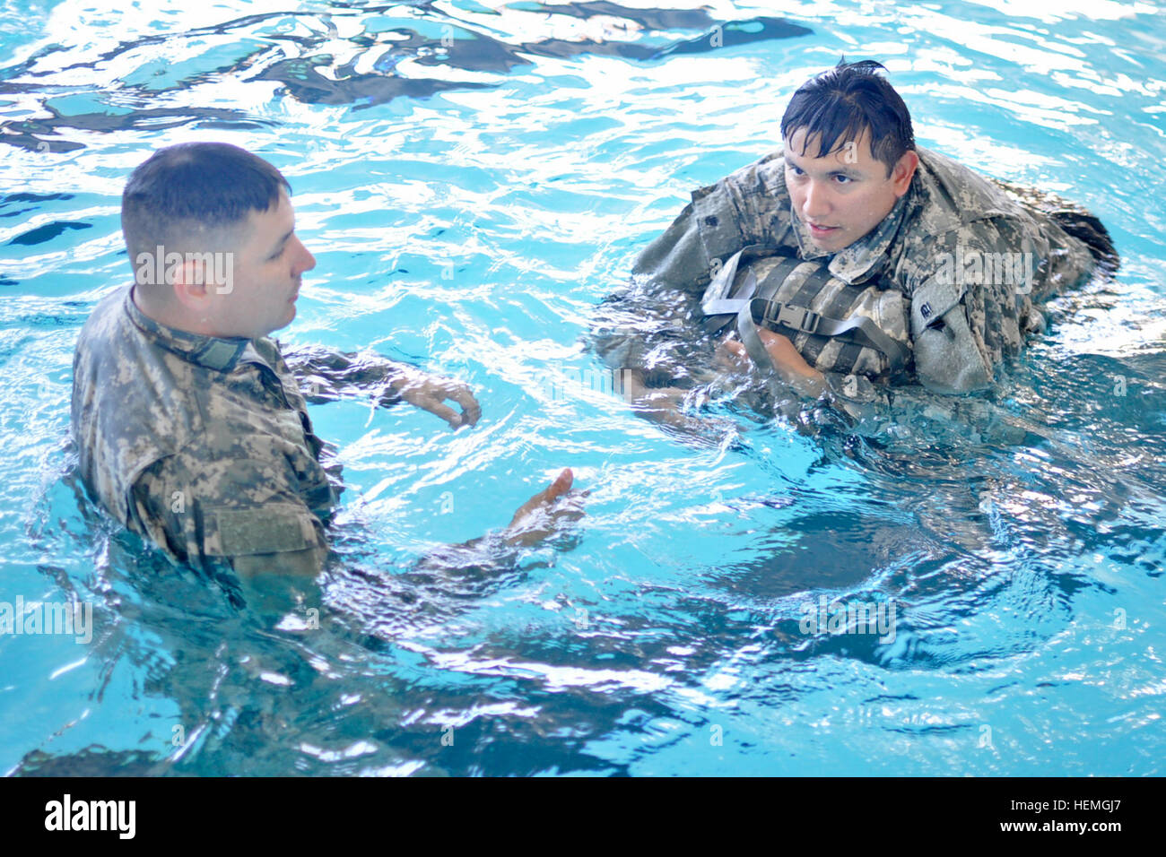 U.S. Army Sgt. 1st Class Eliodoro Molina, left, primary trainer for ...