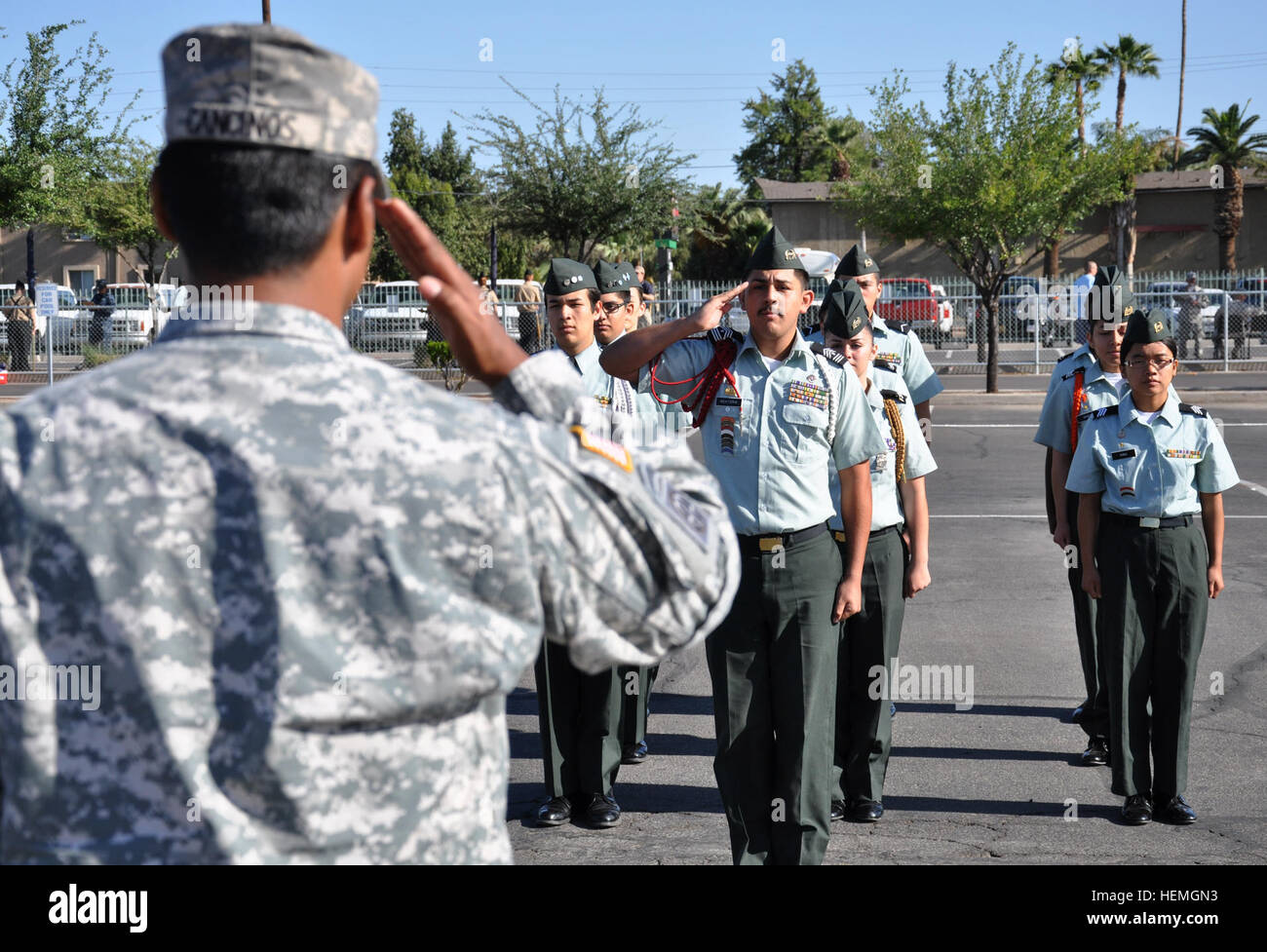 A soldier from the Arizona National Guard returns a salute to a Junior ...