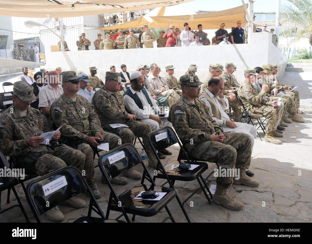 U.S. Service members and guests attend a ceremony marking the end of ...