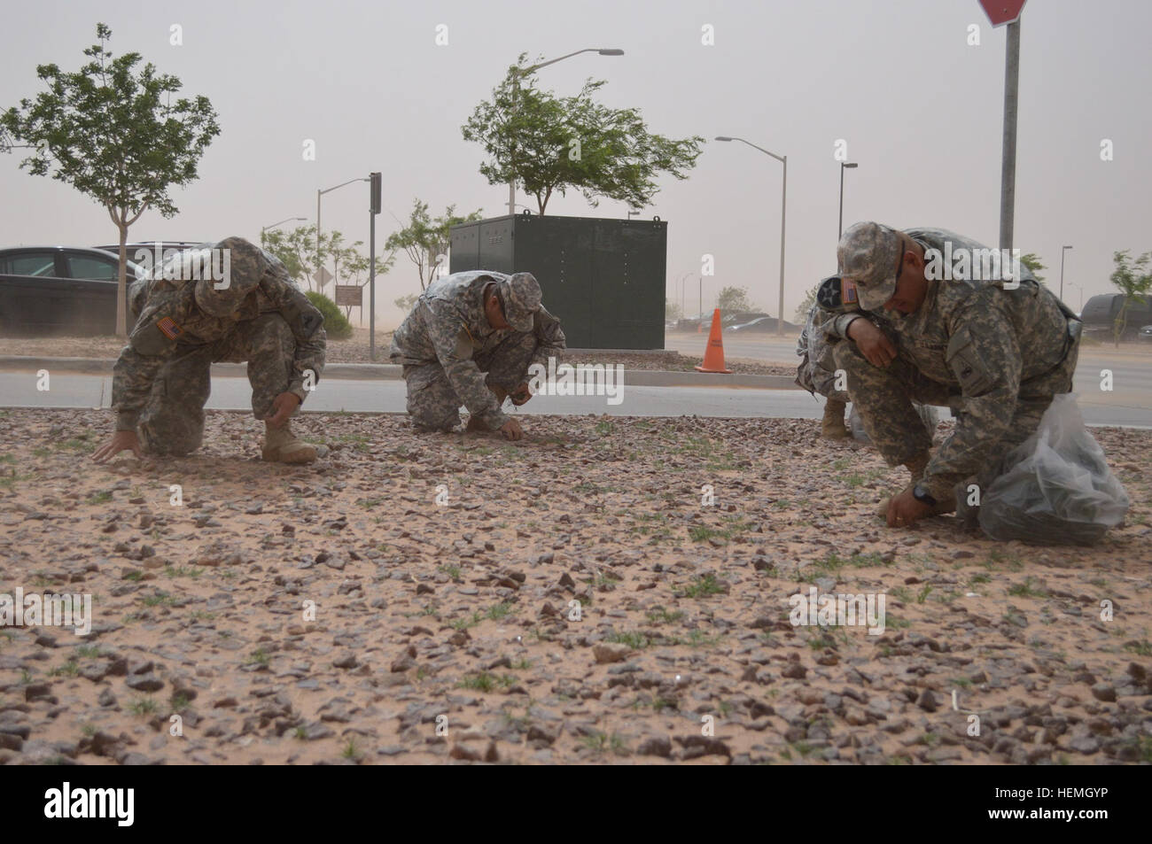 Wind gusts stir up dirt around U.S. Soldiers participating in a post ...