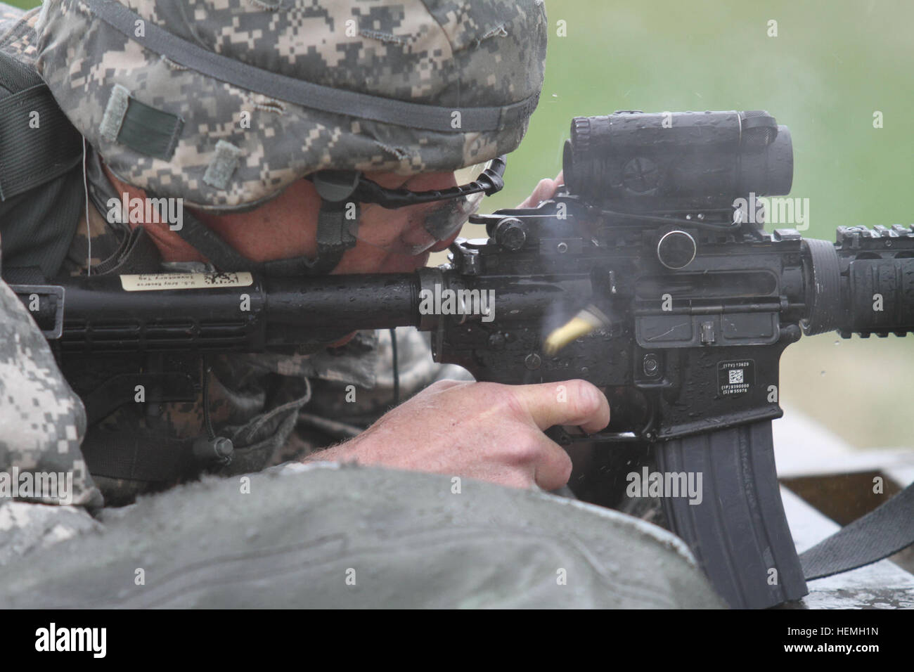 Sgt. 1st Class Chad Krause,102nd Training Division, fires his weapon ...