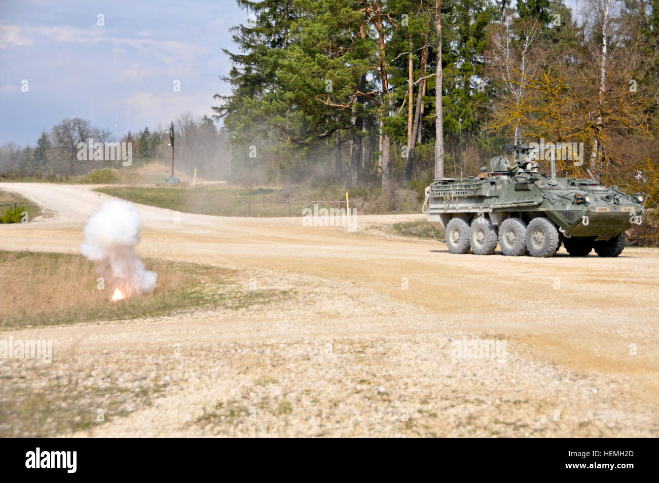 From left, a simulated improvised explosive device detonates as U.S ...