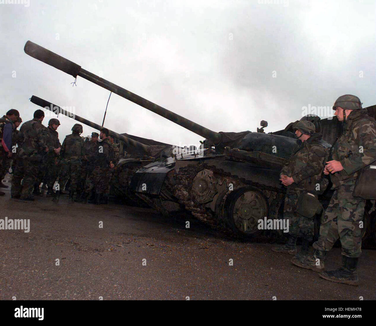 Members of the Division Site Inspection Team inspect T-55 tanks ...