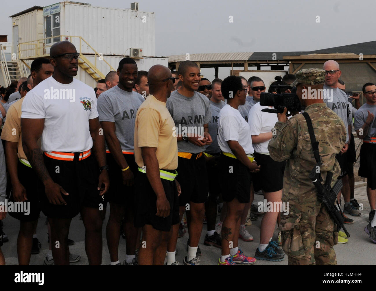 Soldiers gather at the start line of a 5K road race commemorating the ...