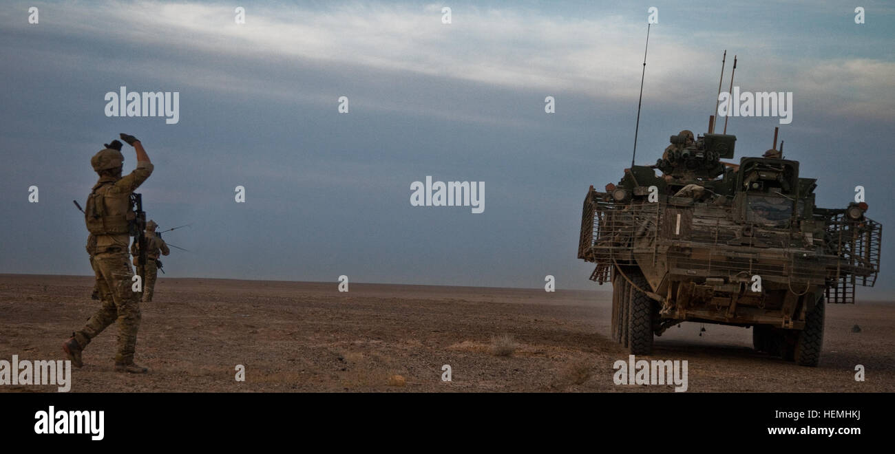 A coalition security force member ground-guides a light infantry ...