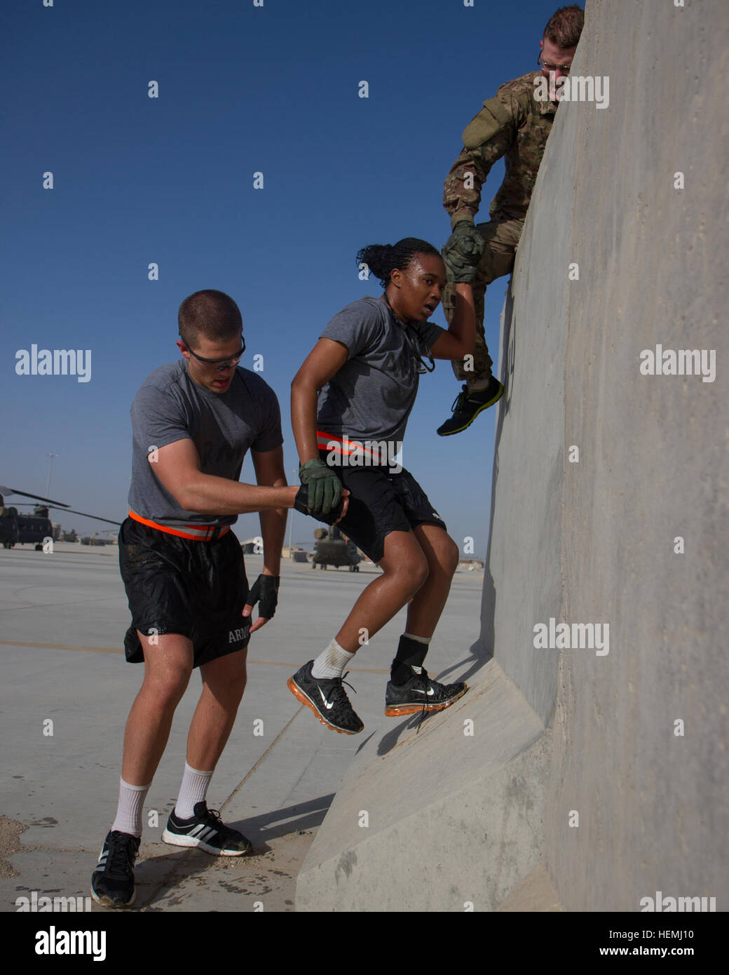 Spc. Jeremy Huggins, left, an aviation operations specialist with ...
