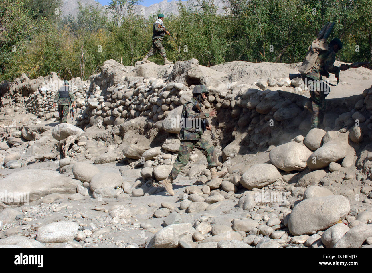 Afghan national army soldiers search a village in Tagab Valley ...