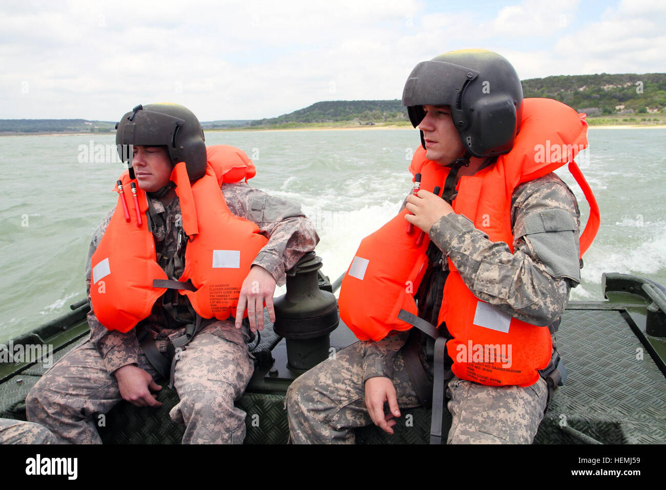 U.S. Army Sgt. Deric Cross, left, and Spc. Alexander Koff depart via ...