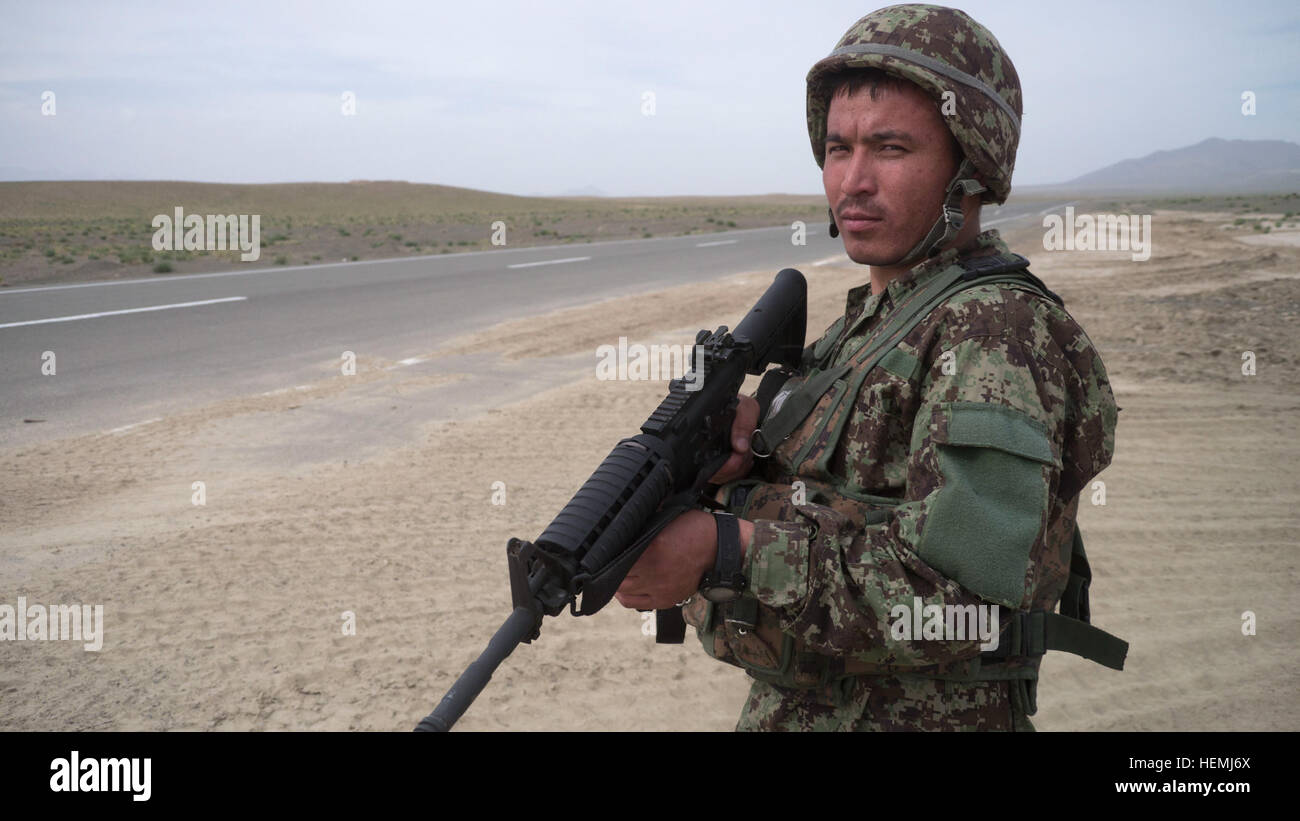 An Afghan soldier provides over watch security during a leader ...