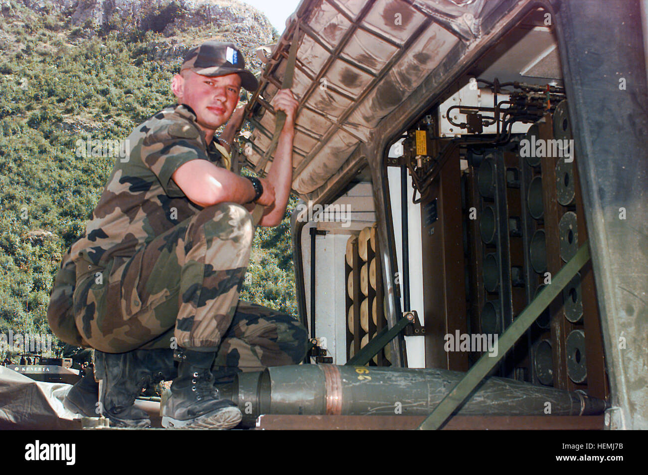 Gunner First Class Arroyo, 40th Regiment d' Artillerie, works in the ...