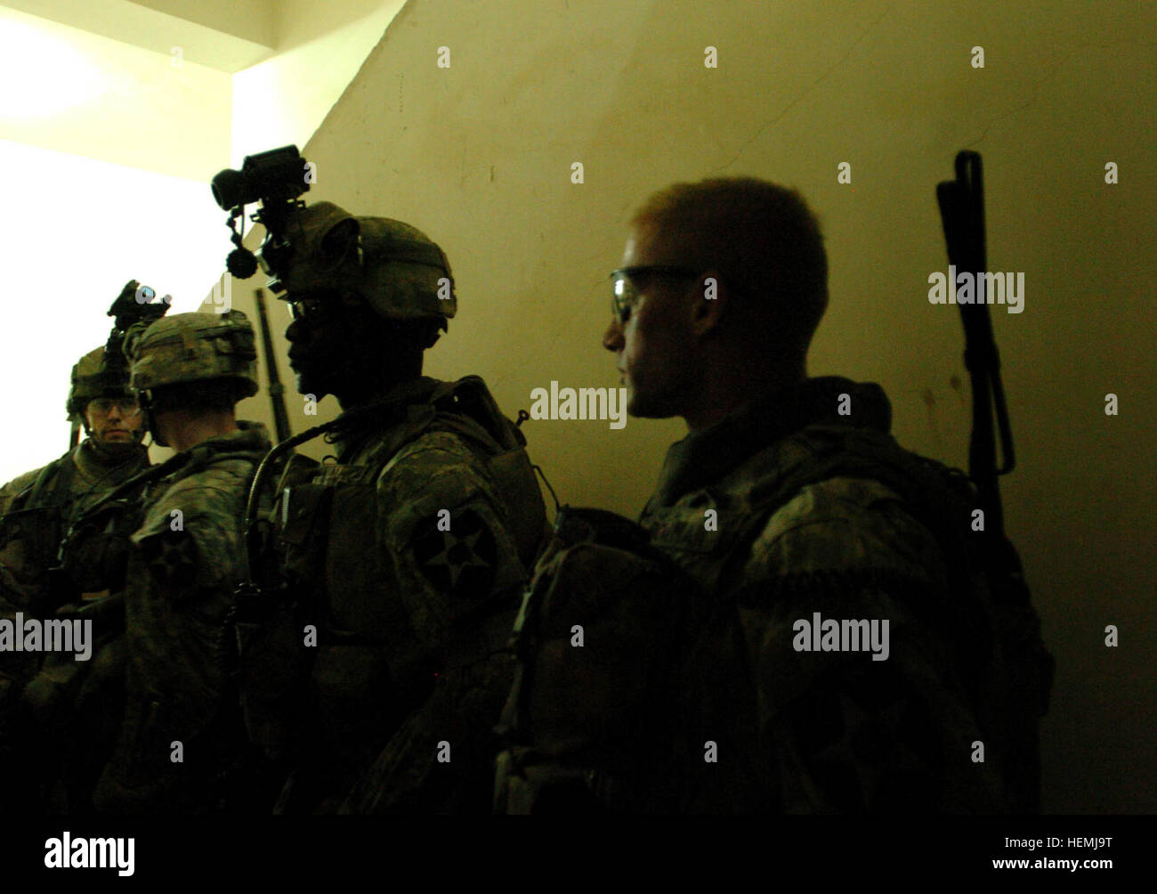 Stryker Soldiers prepare for a midnight mission in Baghdad, Aug. 8. The ...