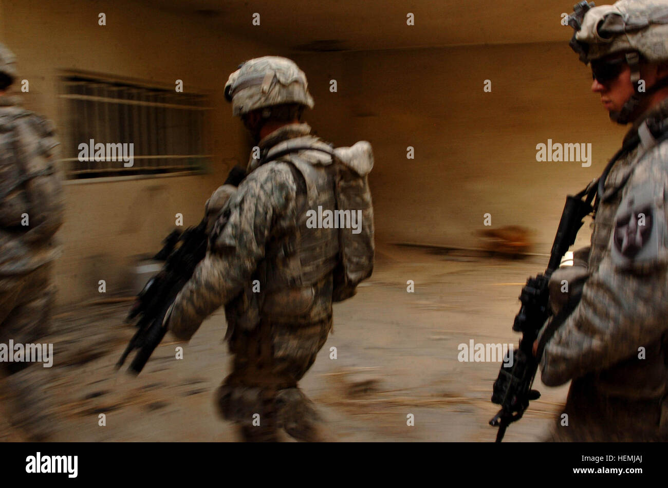 Soldiers from Company B, 2nd Battalion, 23rd Infantry Regiment, rush ...