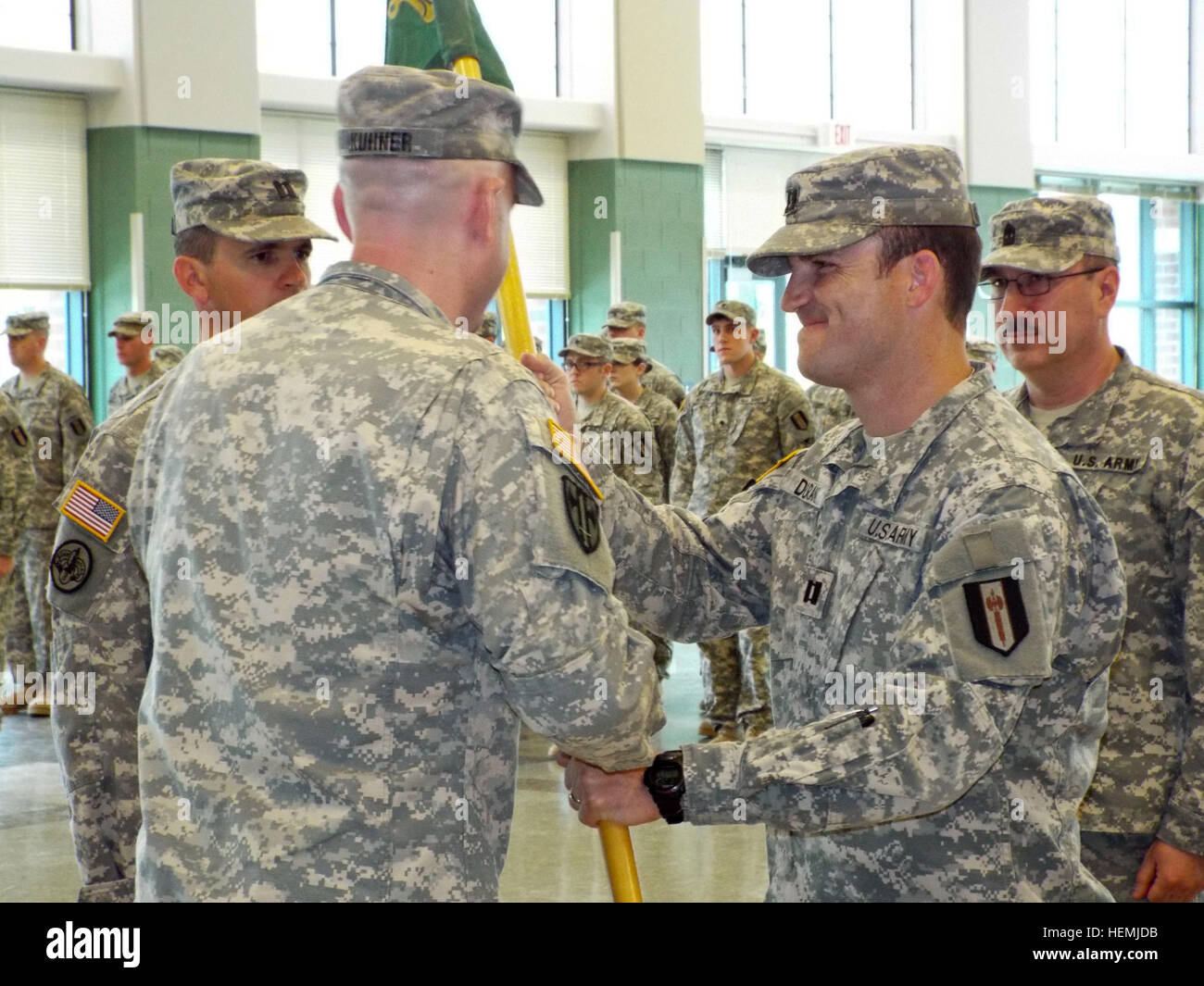 U.S. Army Reserve Capt. Gregory Durant passes the colors signifying his ...