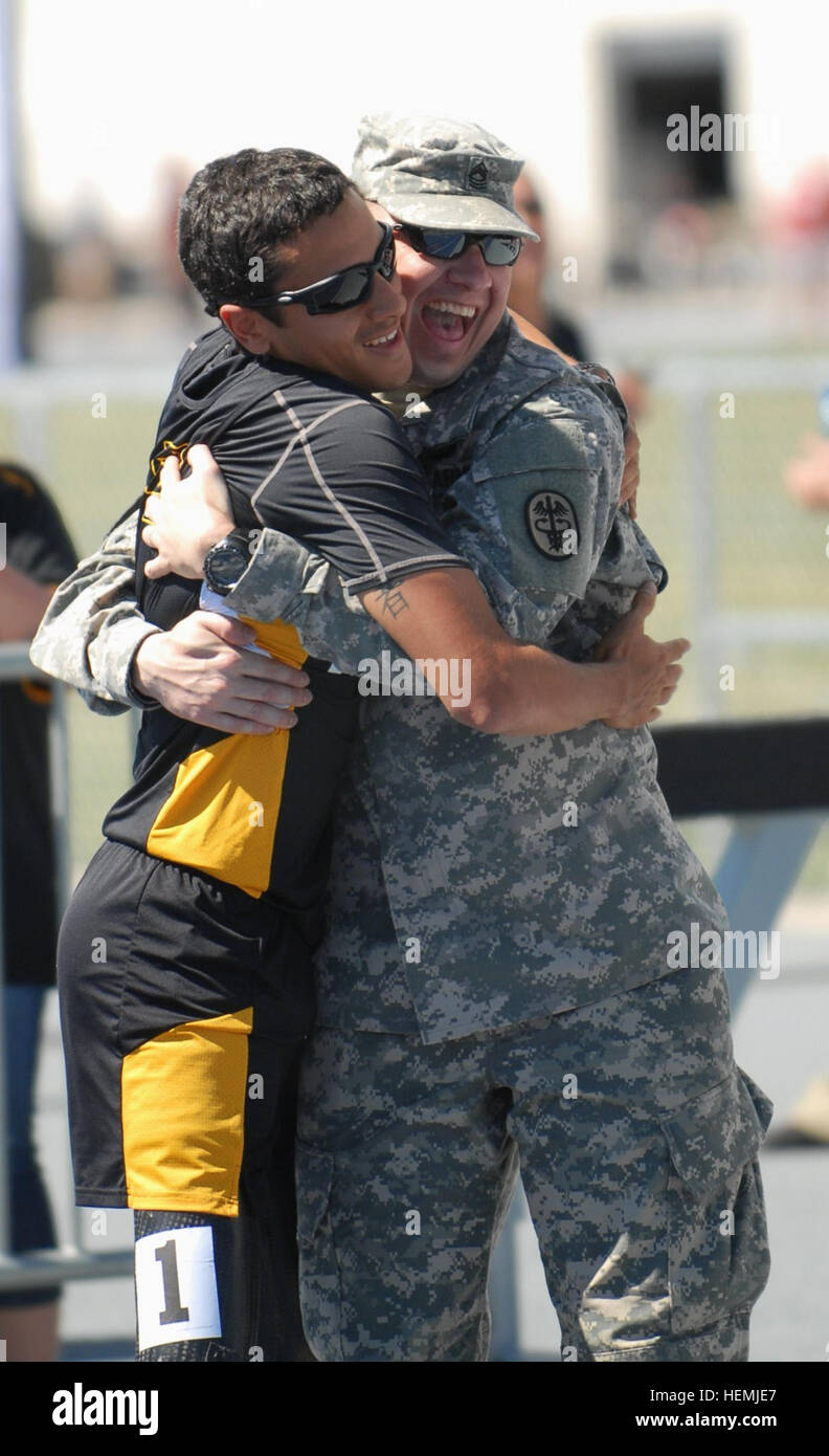 Retired Army Spc. Luis Puertas, celebrates with Army Master Sgt ...