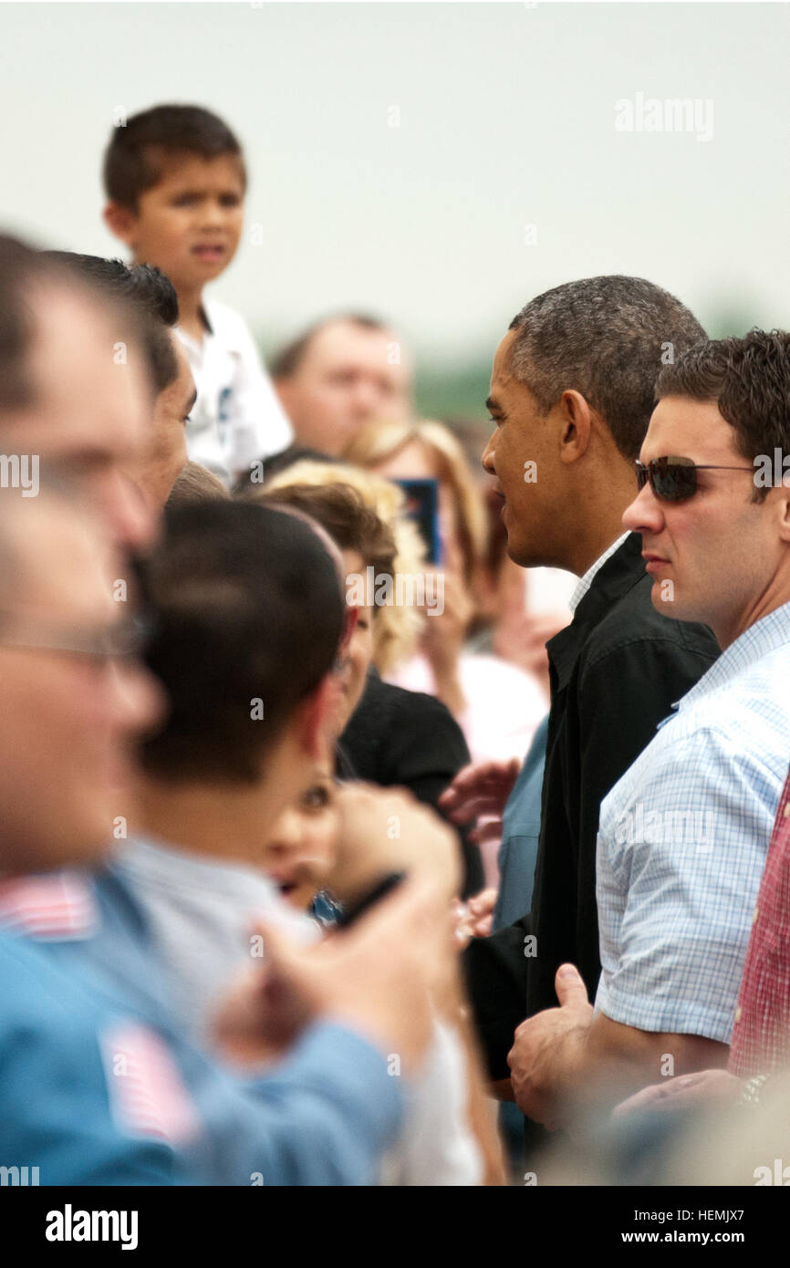President Barack Obama, center, meets with families and first ...