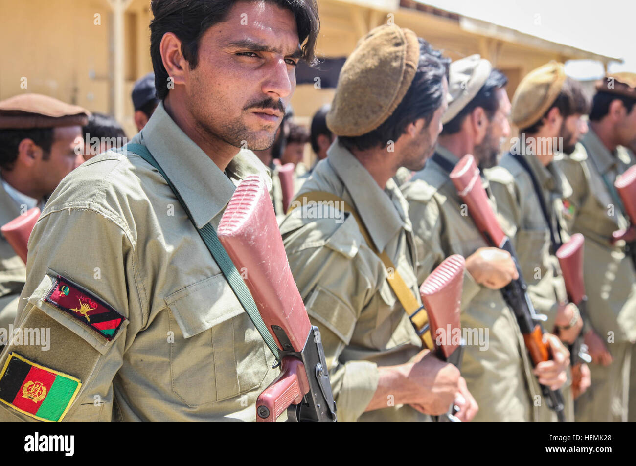 Members of an Afghan Local Police (ALP) class stand in formation during ...