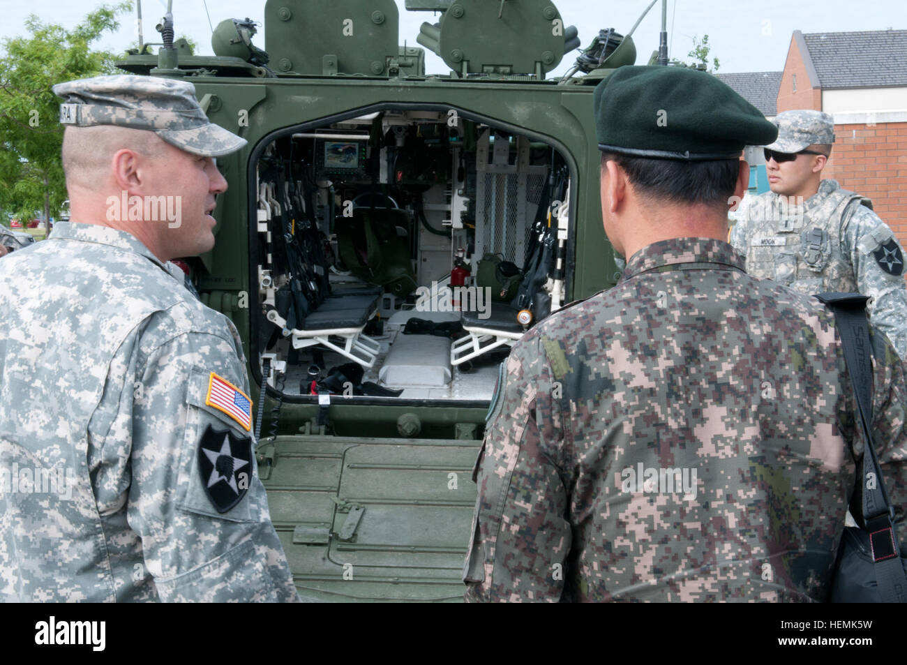 U.S. Army Maj. Gregory Sakimura, left, operations officer with the 1st ...