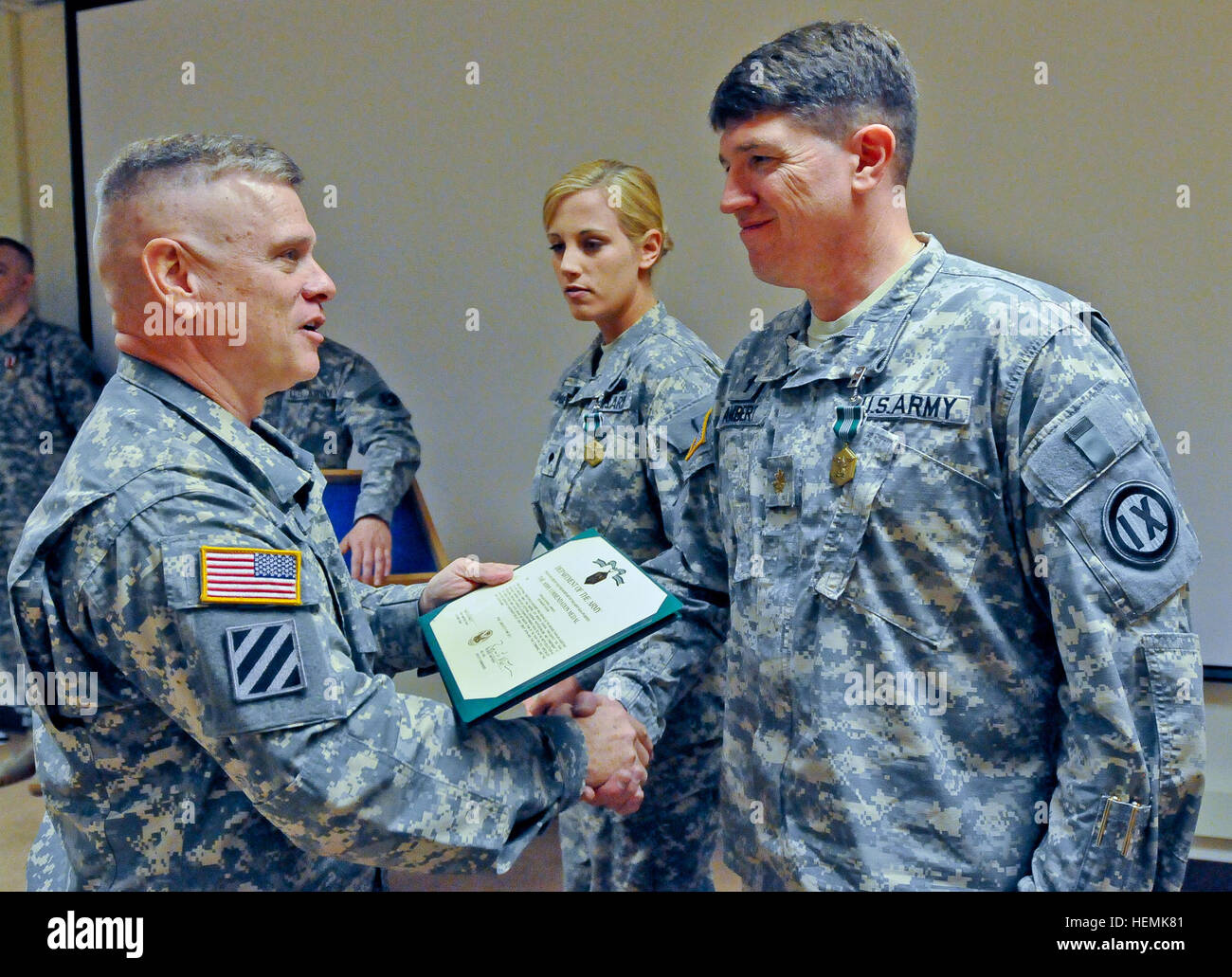 A U.S. Army Reserve chaplain receives the Army Commendation Medal as ...