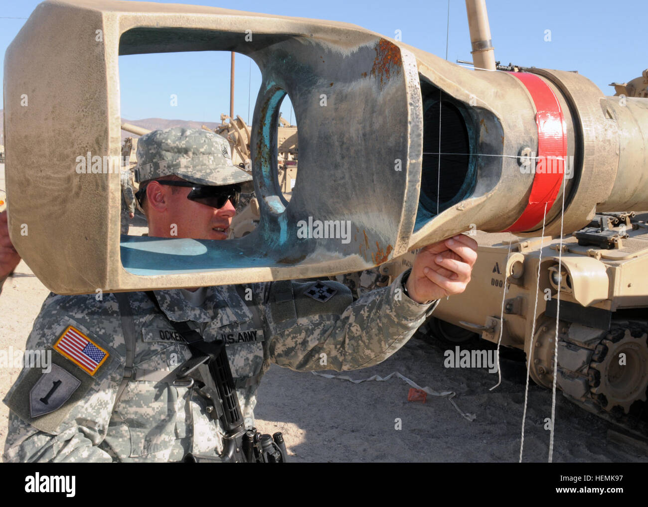 U.S. Army Sgt. Travis Ocker, a cannon crewmember with Alpha Battery ...