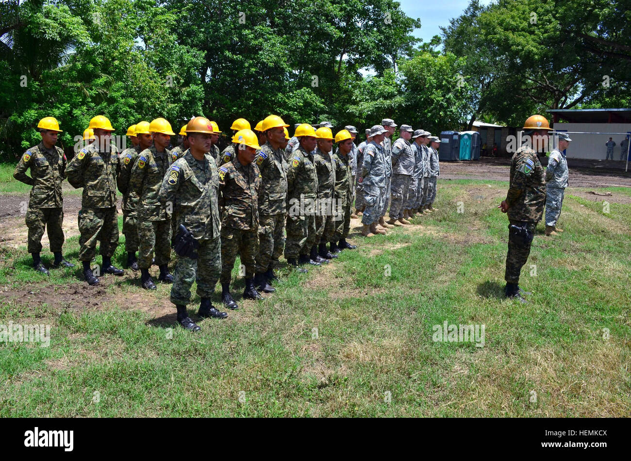 Salvadoran and U.S. Soldiers stand in formation during the ribbon cutting ceremony, outside the ...